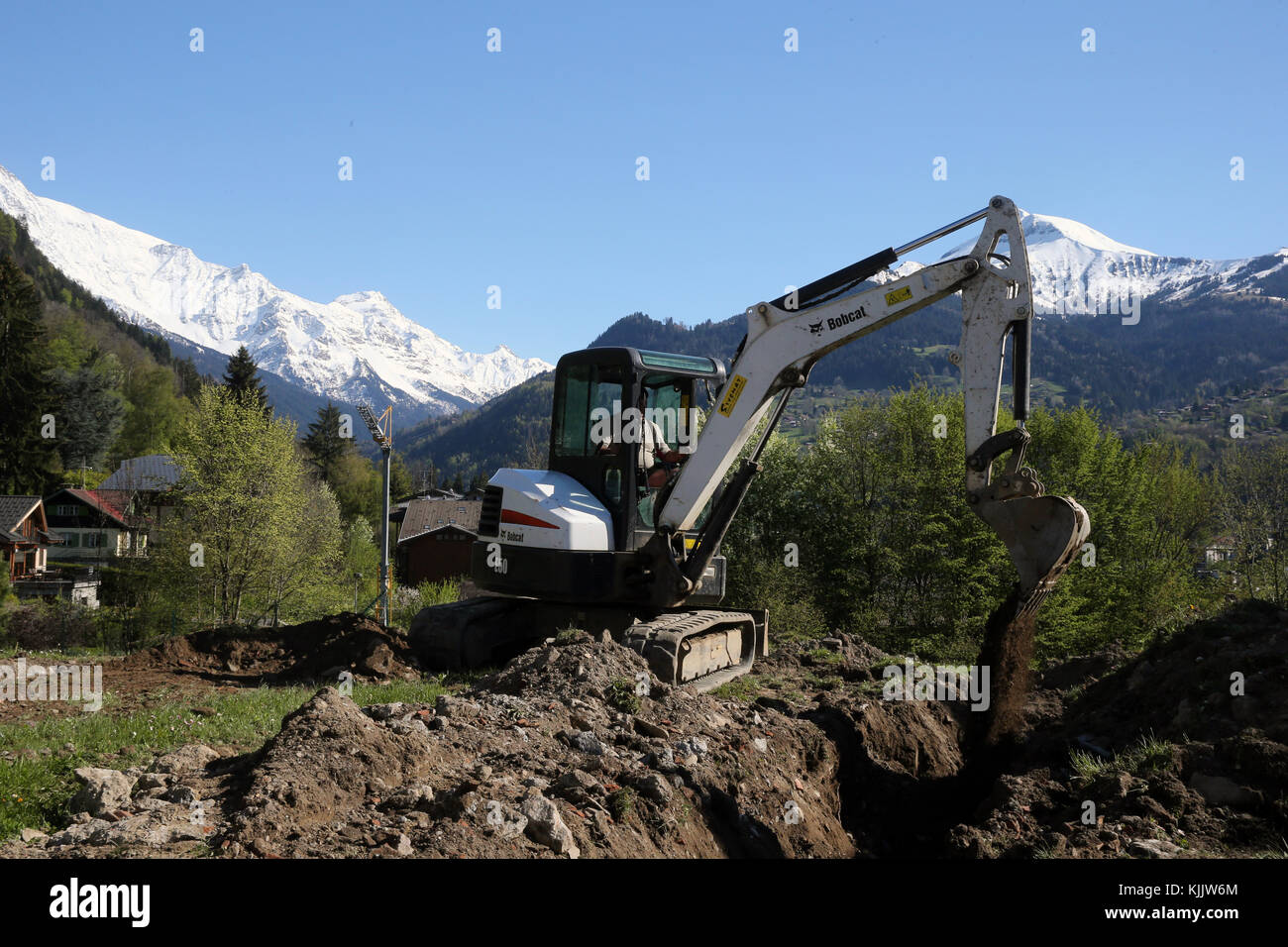 Construction site. Mechanical digger at work in a garden. France Stock ...