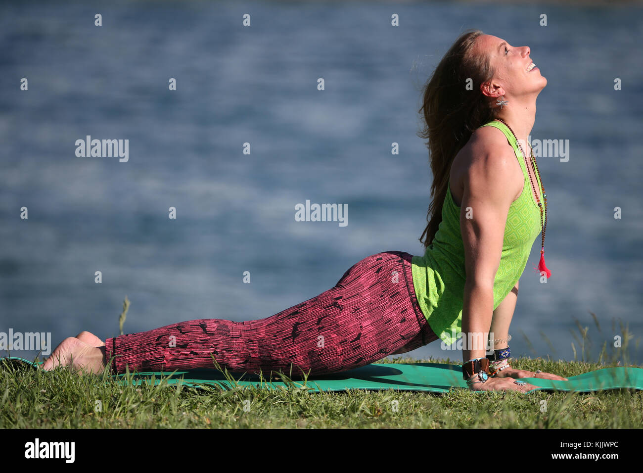 Woman doing yoga and meditation outside Stock Photo - Alamy