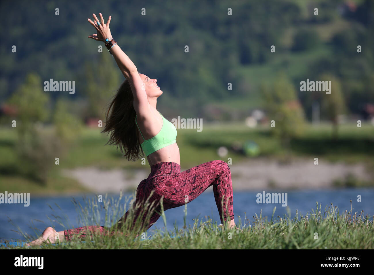 Woman doing yoga and meditation outside Stock Photo - Alamy
