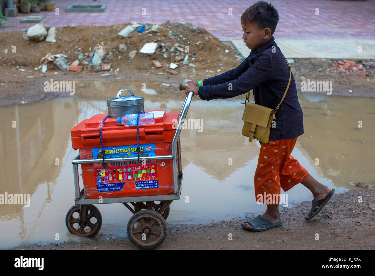 Khmer boy pushing an ice-cream cart. Battambang. Cambodia Stock Photo ...