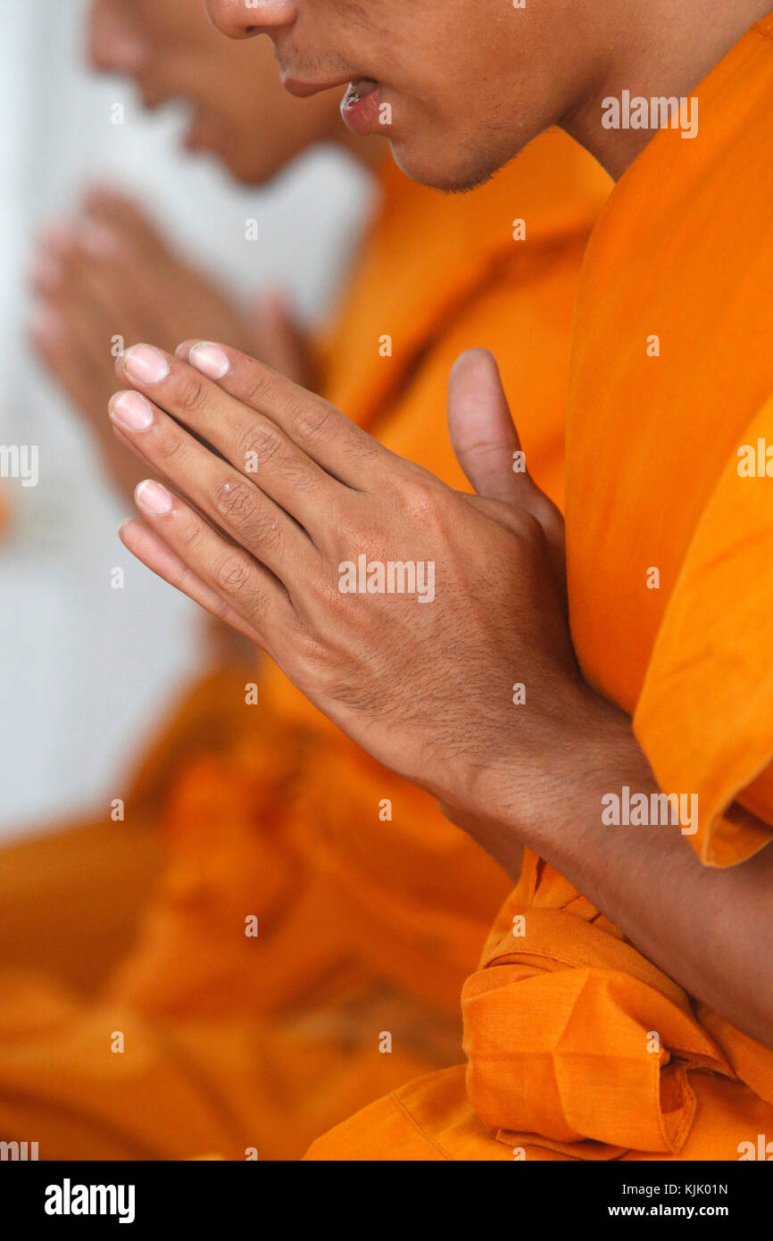 Buddhist monks praying orange hi-res stock photography and images - Alamy