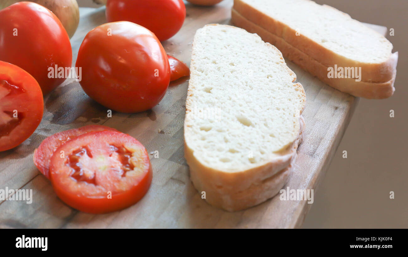 sliced bread and sliced tomato on the wooden block Stock Photo - Alamy