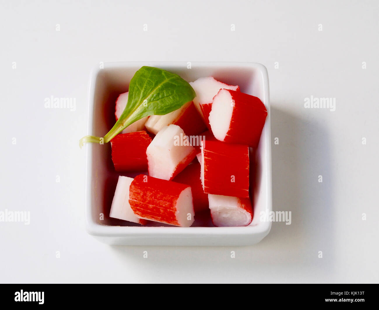 Surimi in a recipe on white background Stock Photo - Alamy