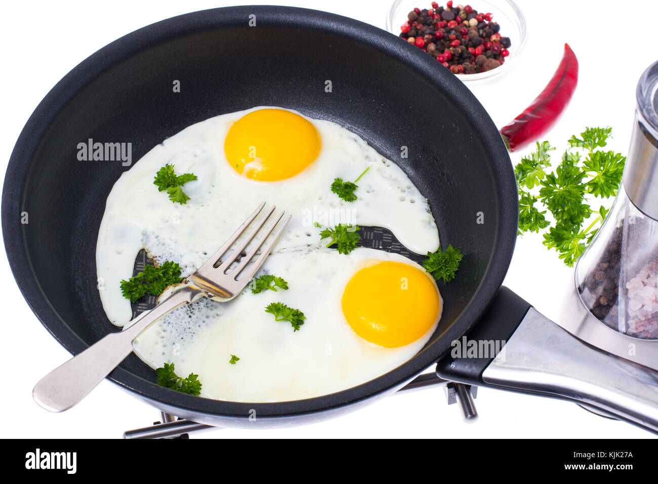 Two fried eggs on Teflon frying pan. Studio Photo Stock Photo - Alamy