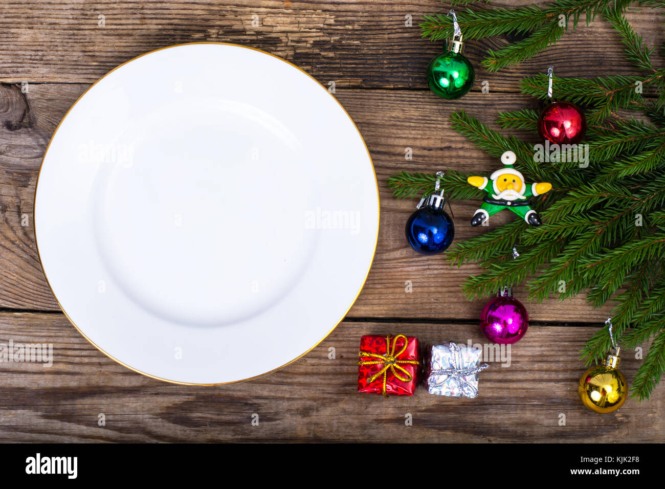Christmas dinner on background with rustic table decorations. View from ...