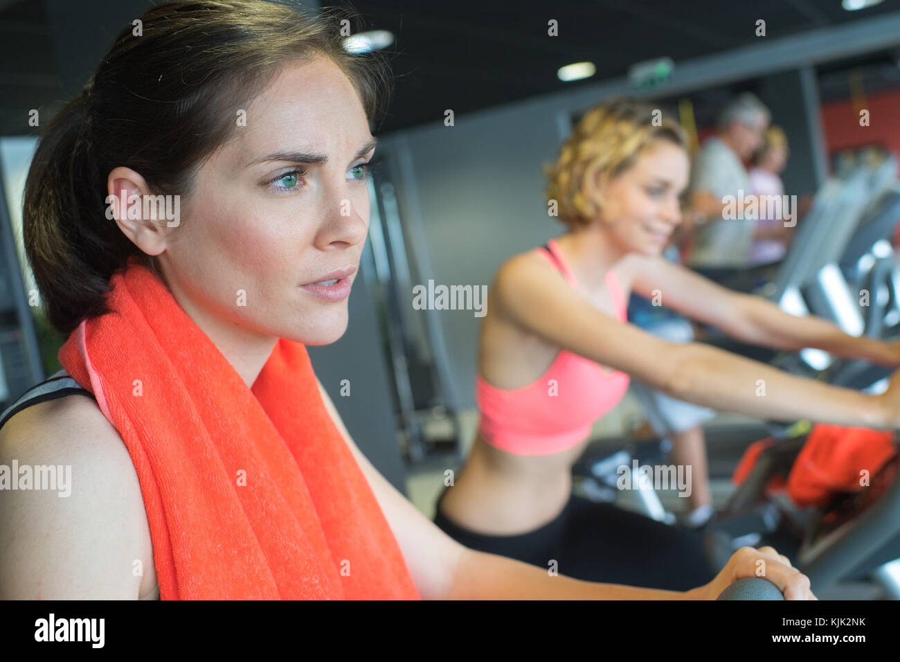 Women on exercise machines Stock Photo - Alamy