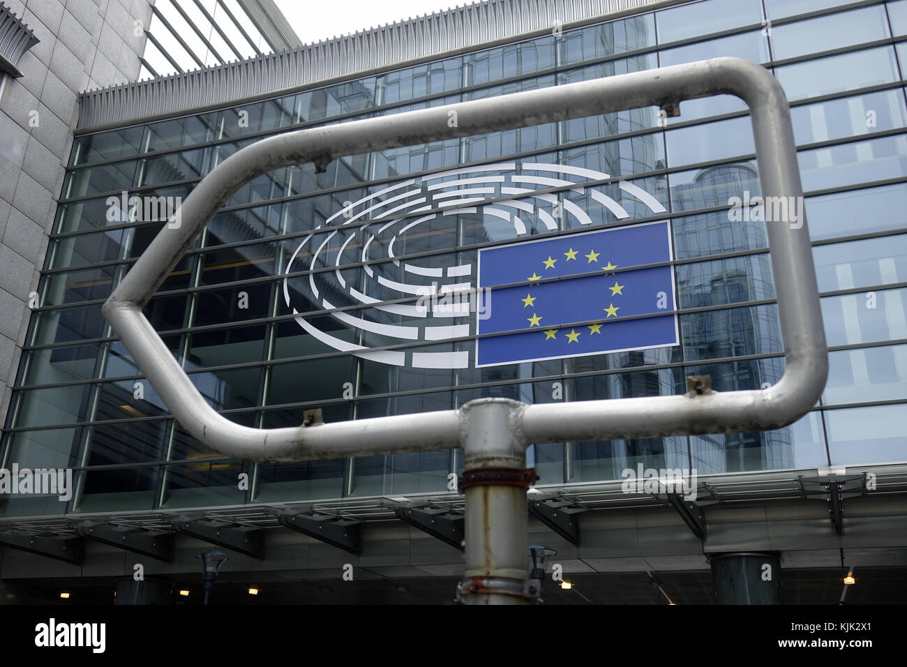 The logo of the European Parliament seen through the metal frame of a ...