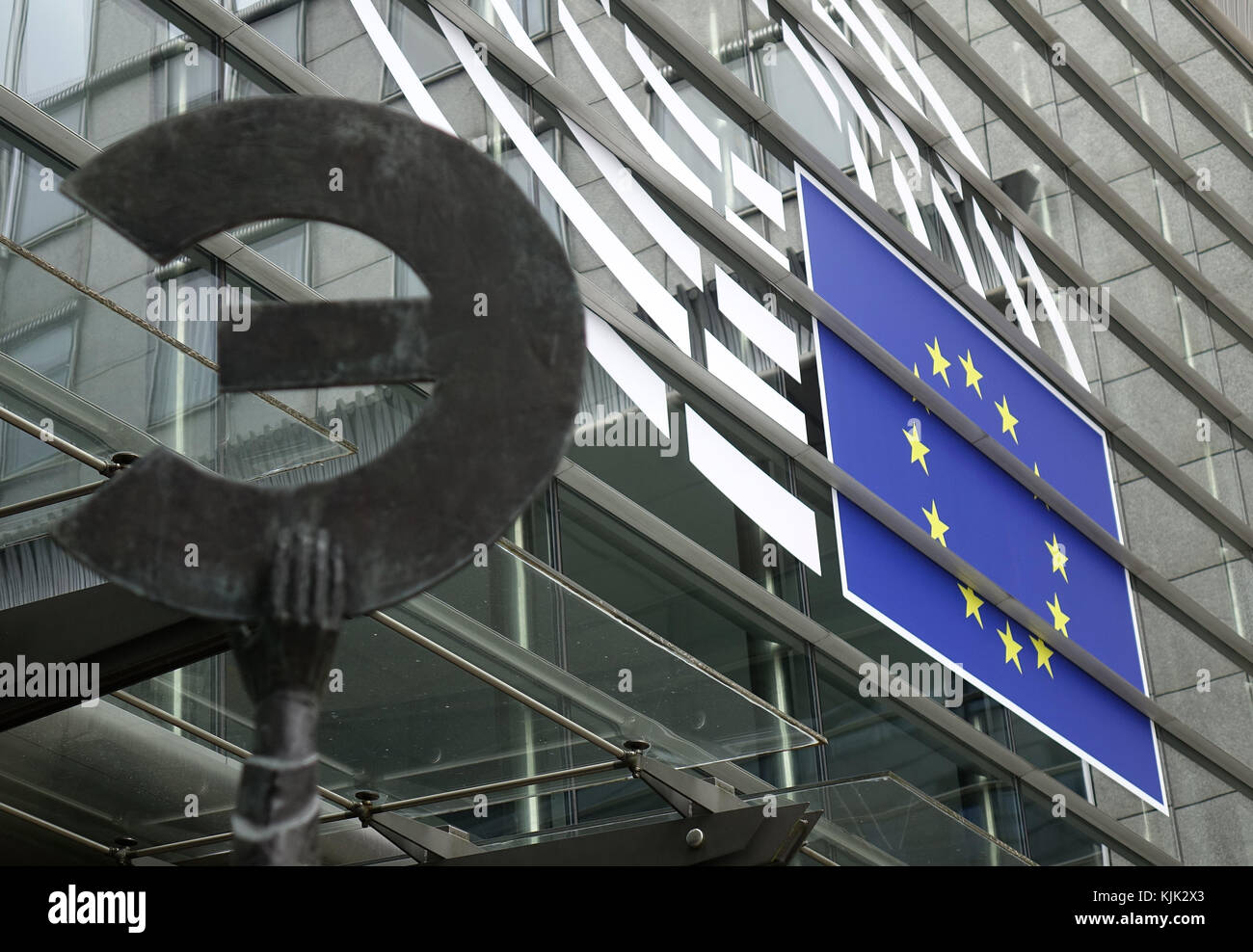 A euro symbol and the logo of the European Parliament outside the ...