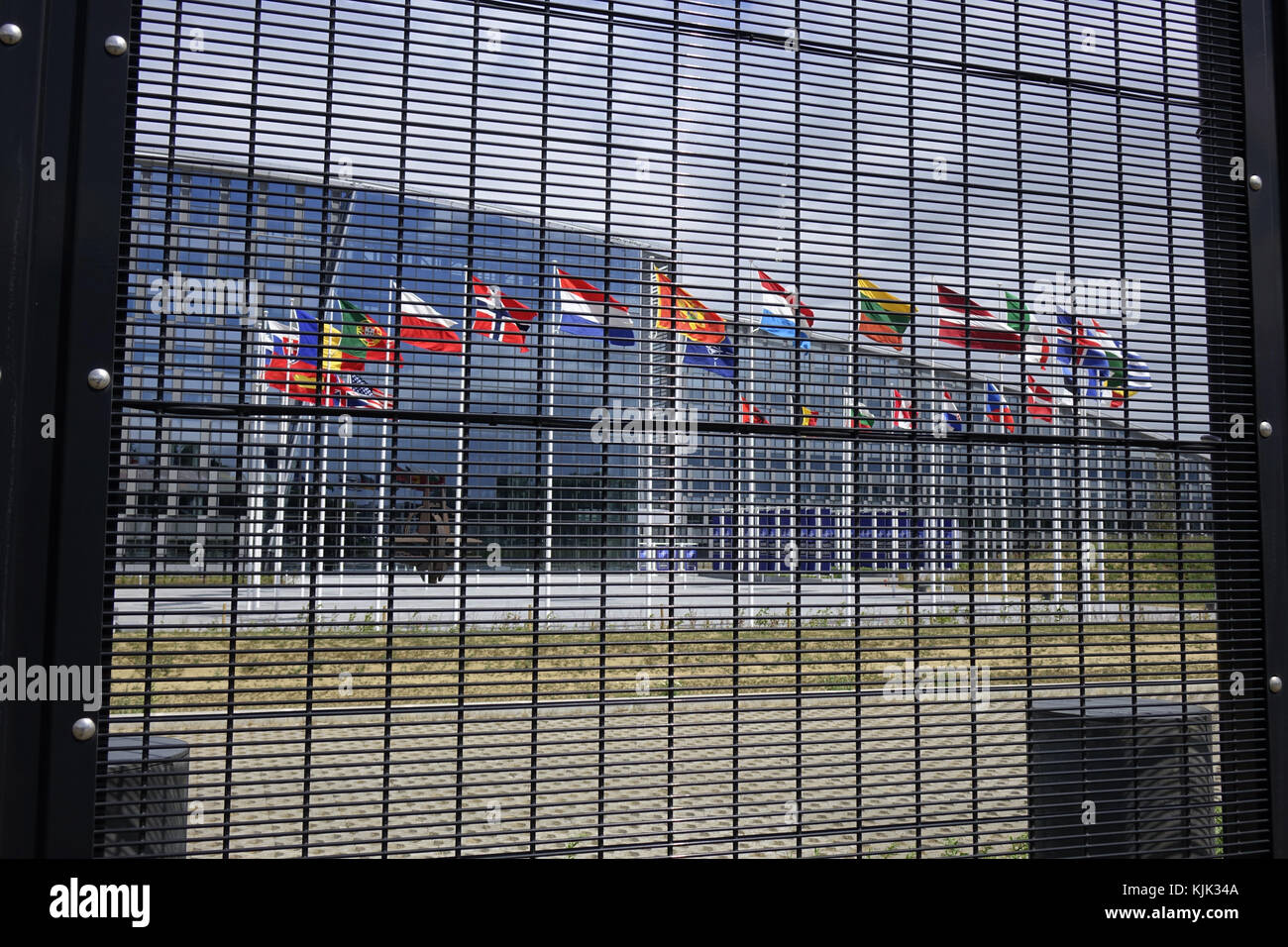 The flags of member states behind a security fence outside the new ...