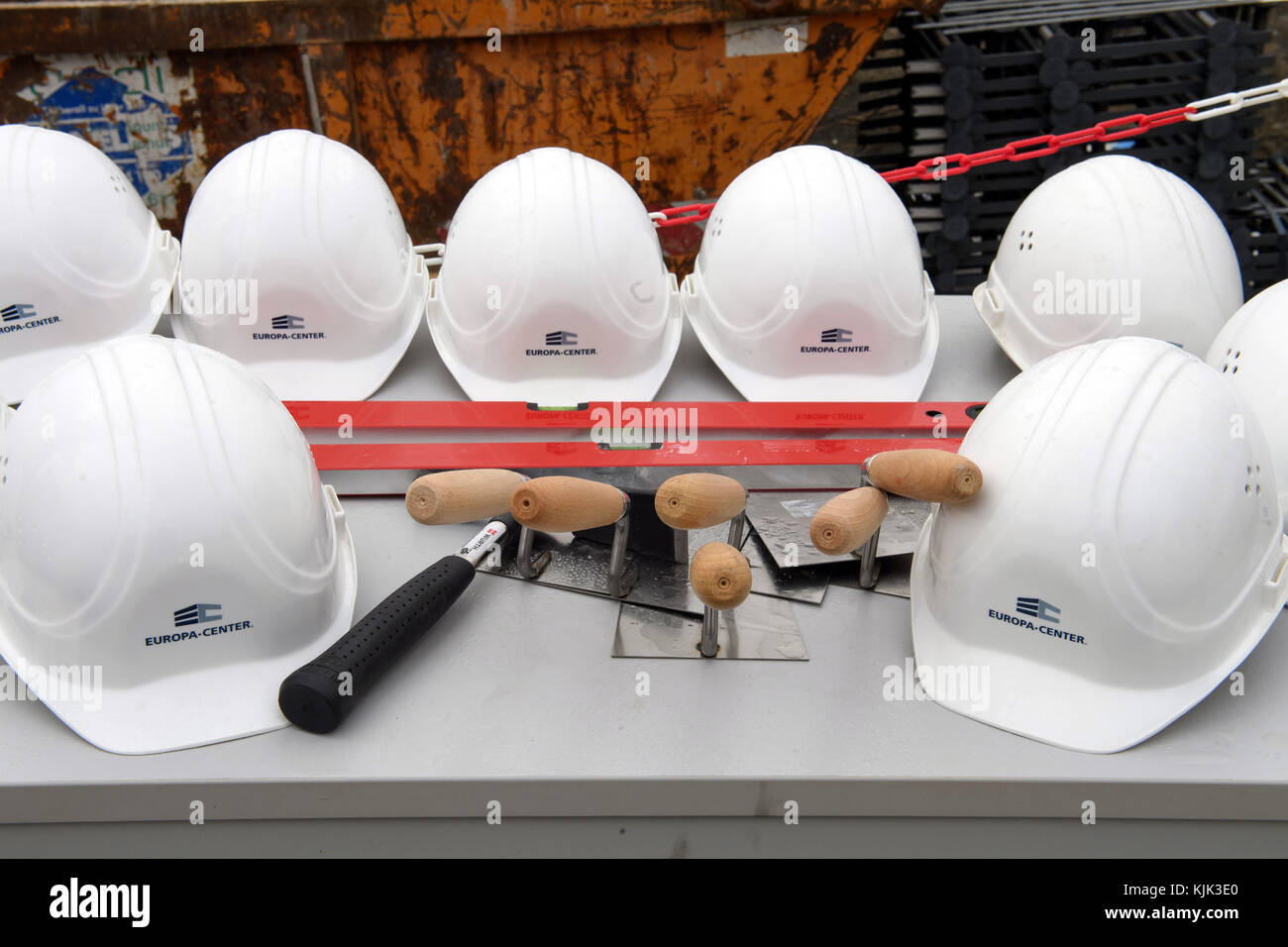 Helmets and masonry tools are symbolically laid ready for the ...