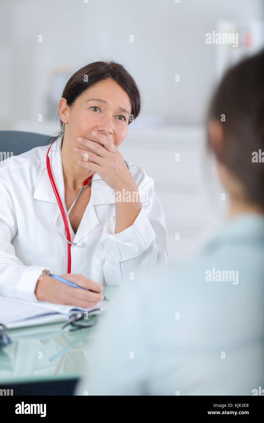 portrait of a beautiful female doctor working in her office Stock Photo ...