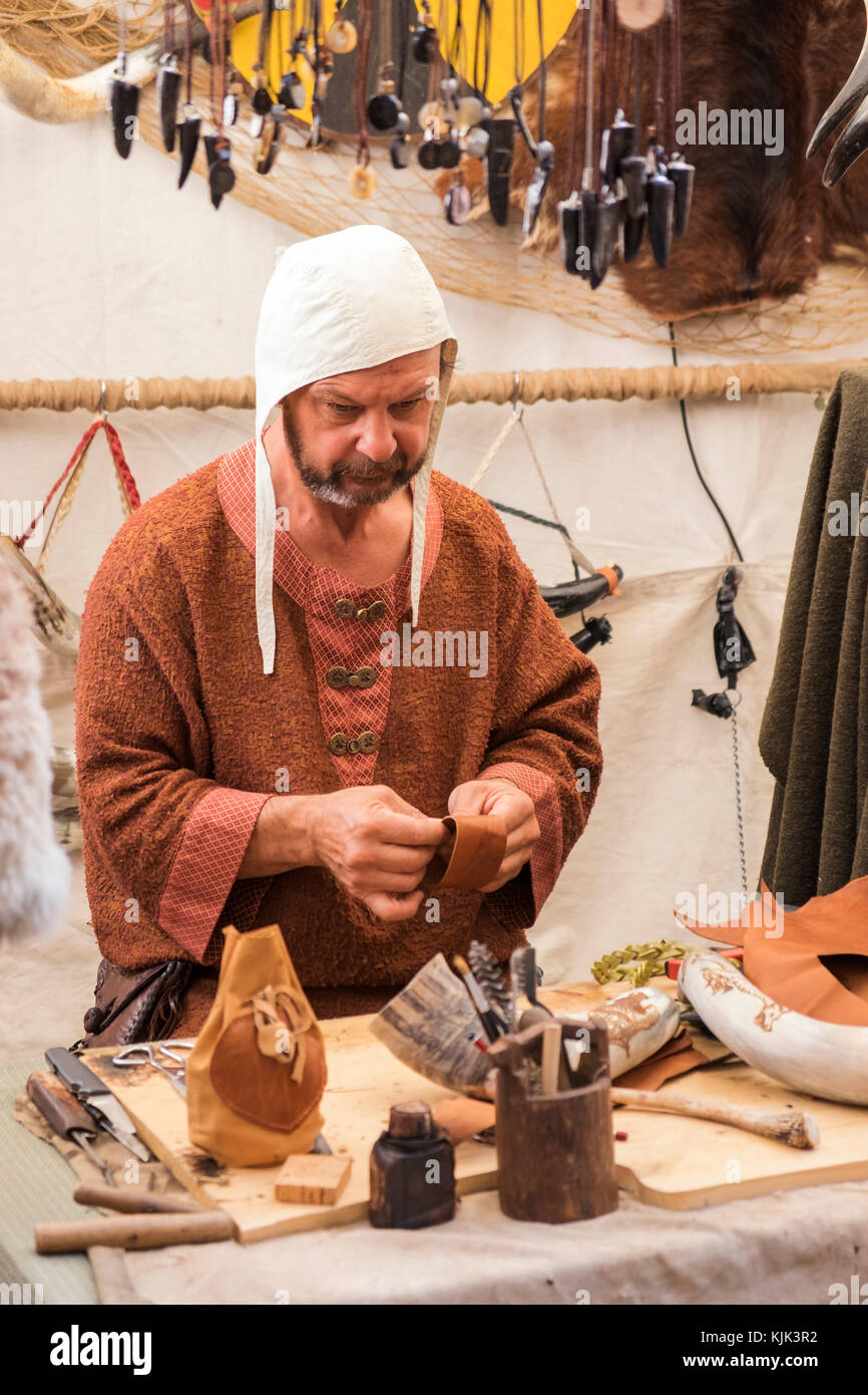 Leather man working in a medieval market in Ávila Stock Photo - Alamy
