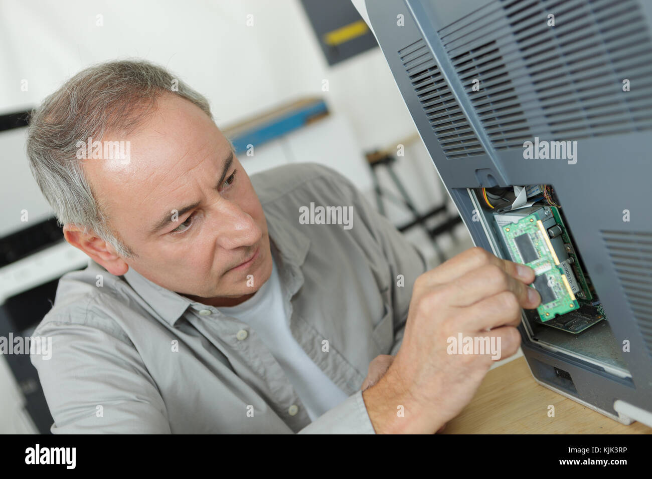 middle age man fixing electronic circuits closeup Stock Photo - Alamy