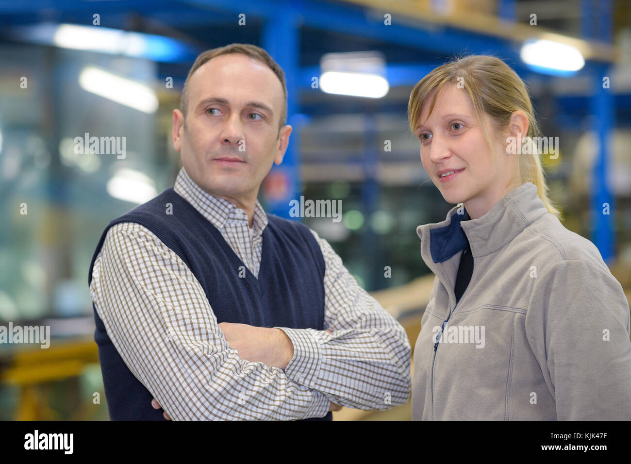manager and worker in warehouse Stock Photo - Alamy