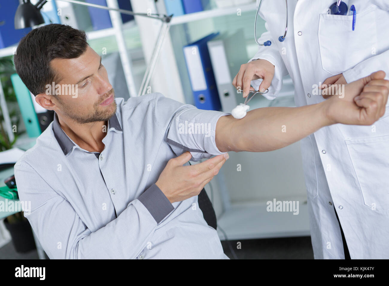 doctor getting ready to inject patient with sterile syringe Stock Photo ...