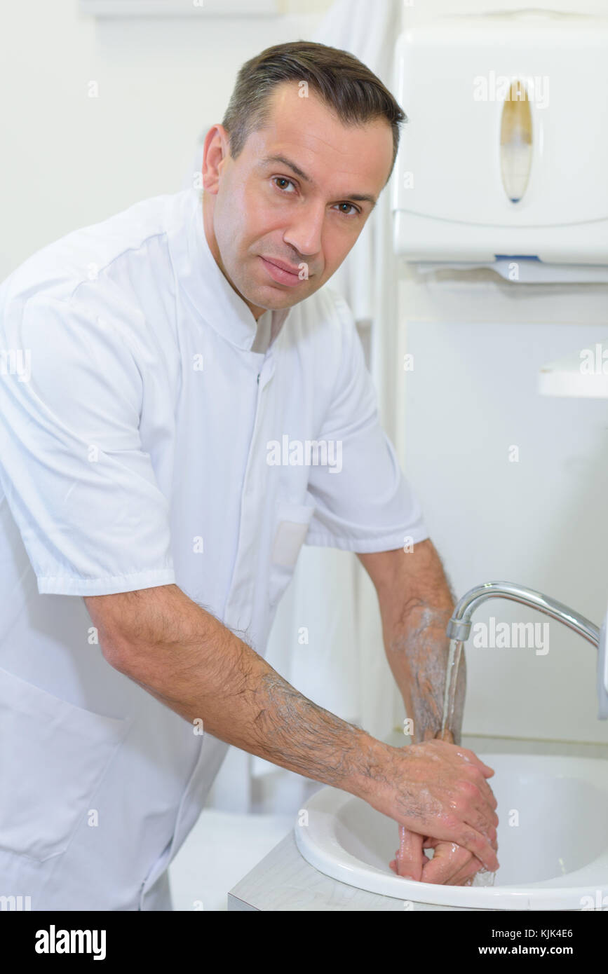 Portrait of doctor washing hands Stock Photo - Alamy