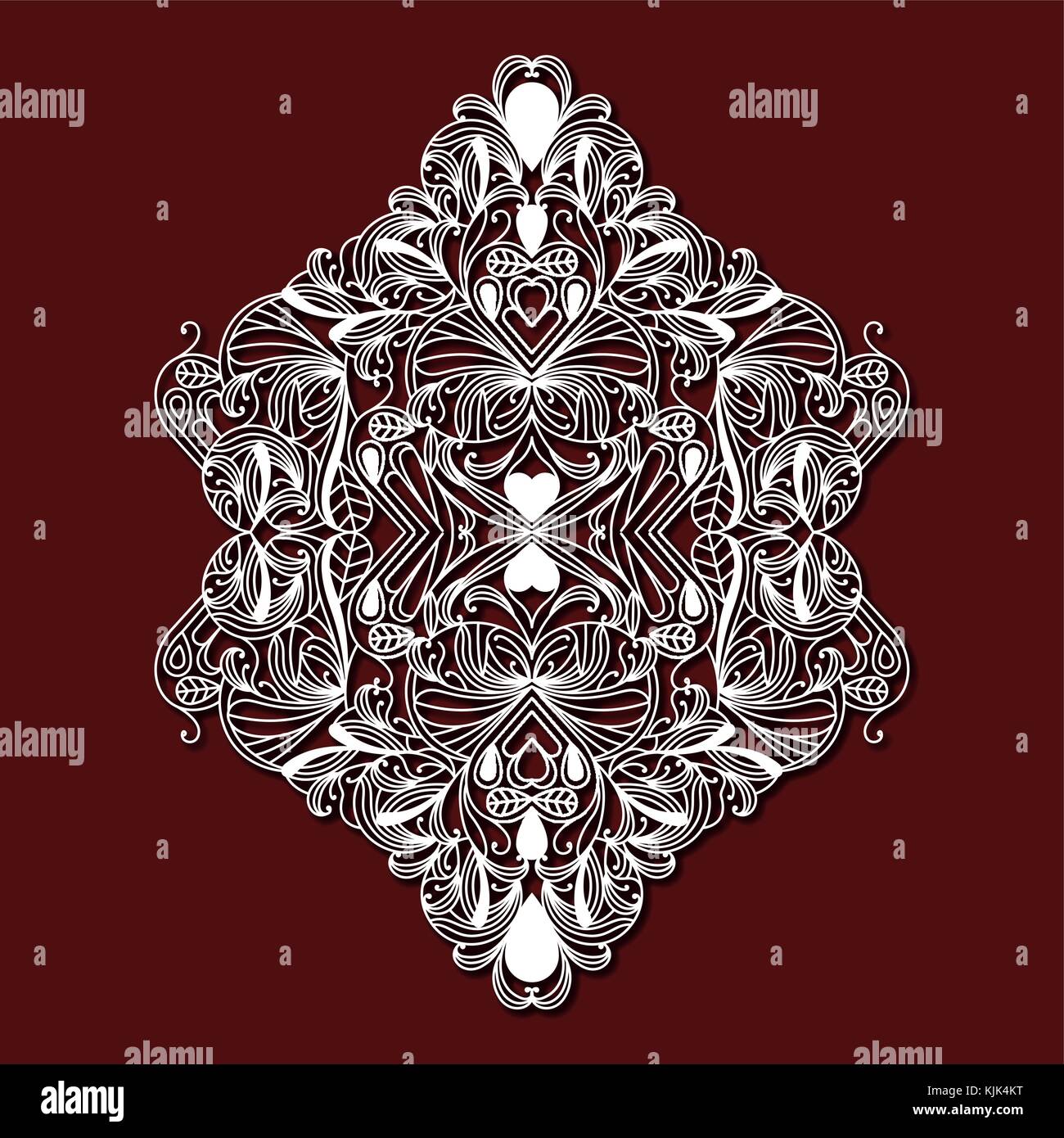 laser cutting ornamental floral design in dark red color background ...