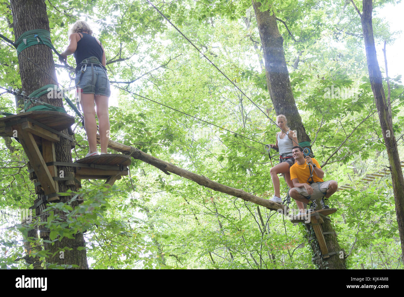 women in an adventure park wearing protective gear Stock Photo - Alamy