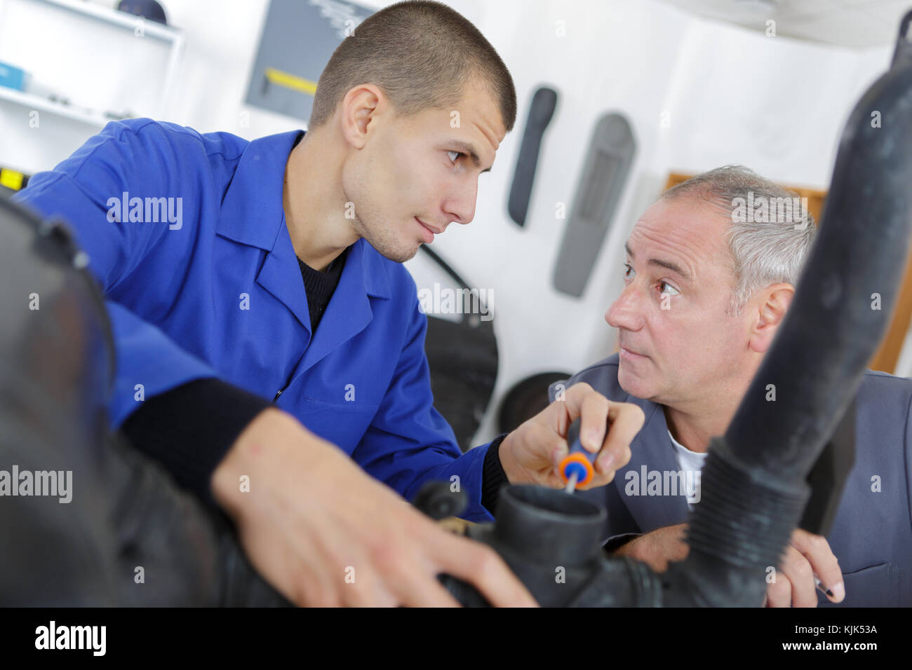 student with auto part studying automotive trade Stock Photo - Alamy