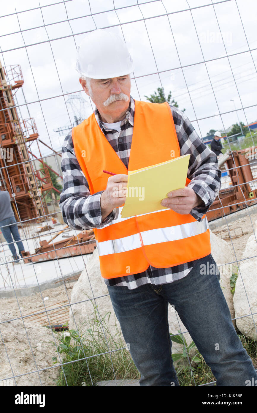 expertise architect senior engineer plans construction outdoors Stock ...