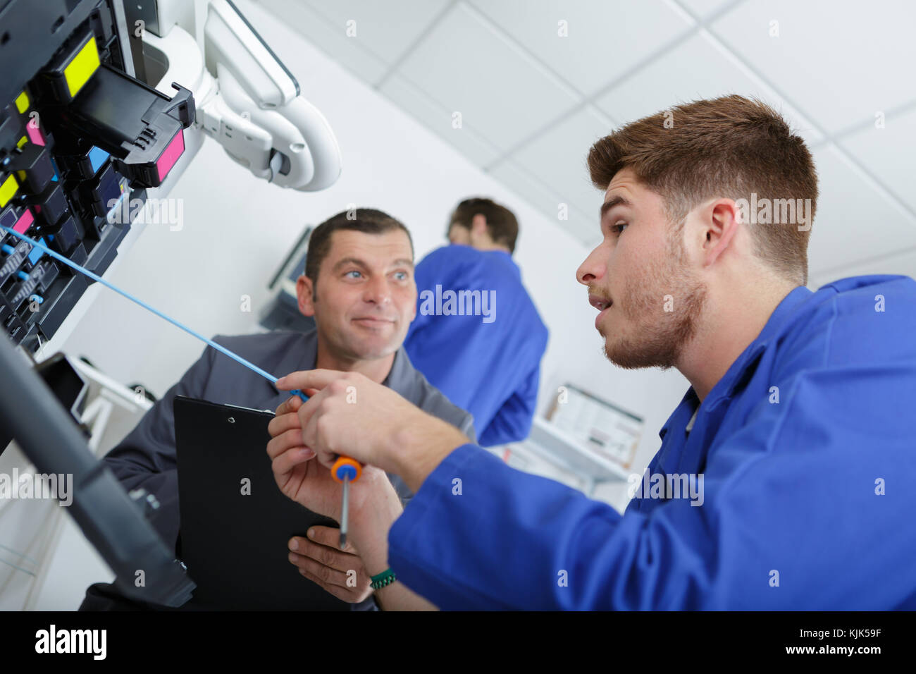 male machinist working on machine part Stock Photo - Alamy