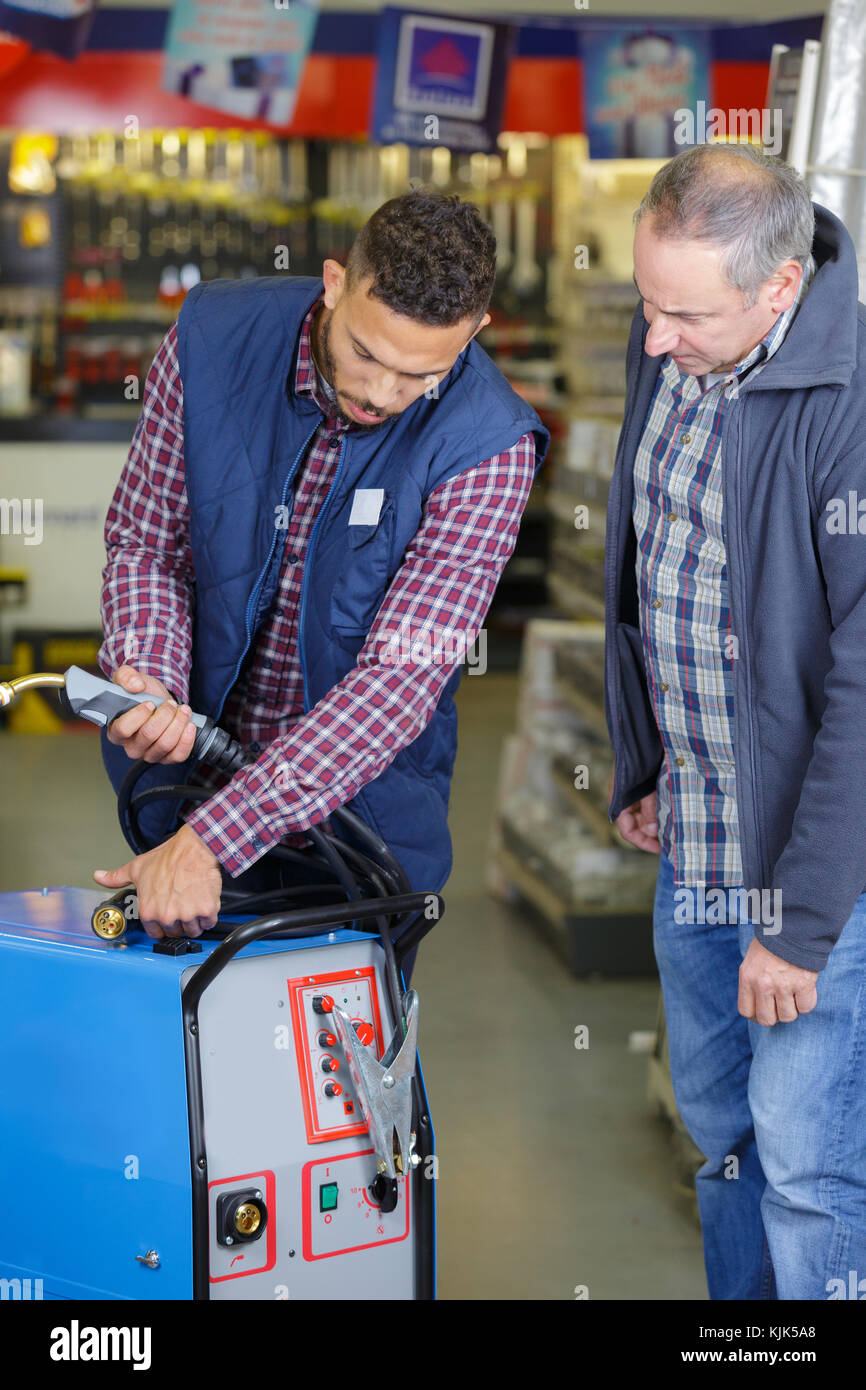 factory workers in the process of working on the equipment Stock Photo ...