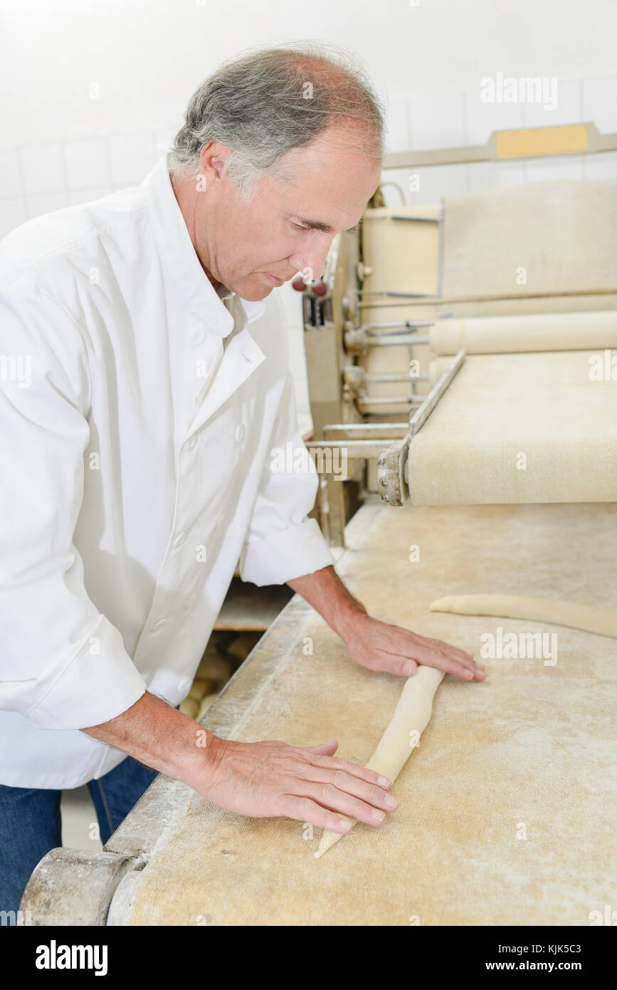 Baker making bread Stock Photo - Alamy
