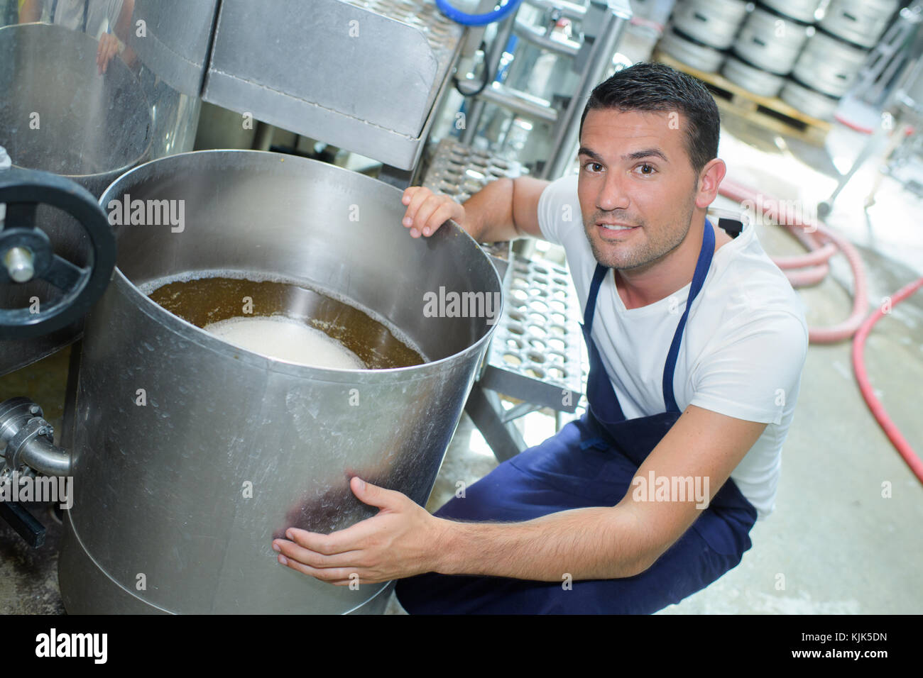 positive male brewery worker on beer production factory Stock Photo - Alamy