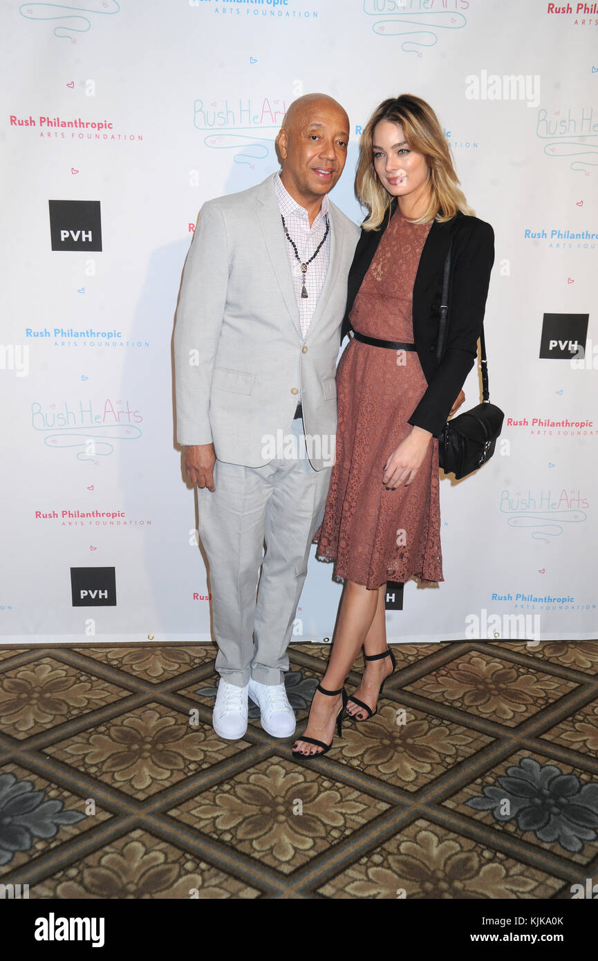 NEW YORK, NEW YORK - MARCH 11: Russell Simmons, Lucy McIntosh attends ...