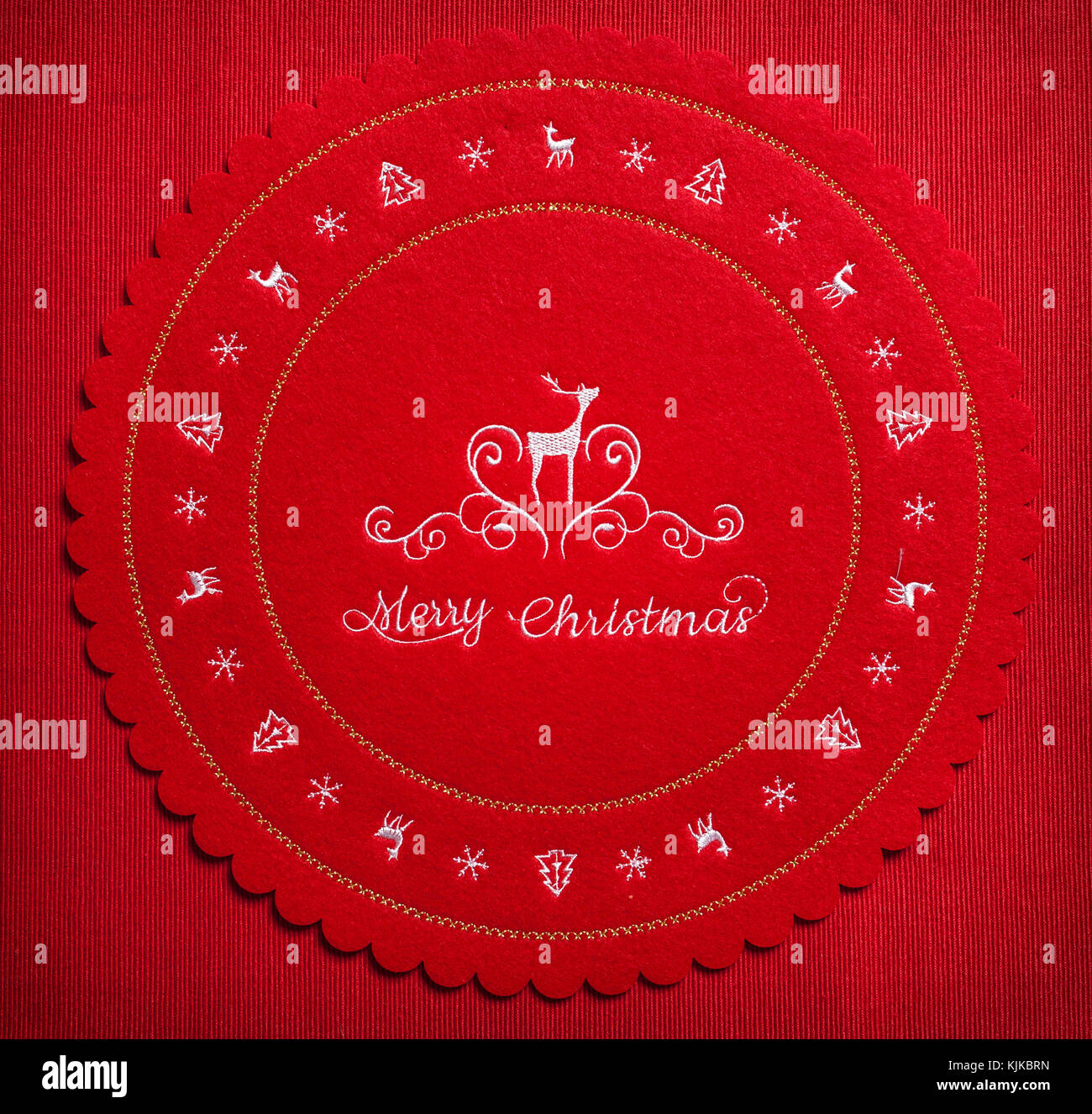 Red fabric cloth or tablemat with Merry Christmas text Stock Photo - Alamy