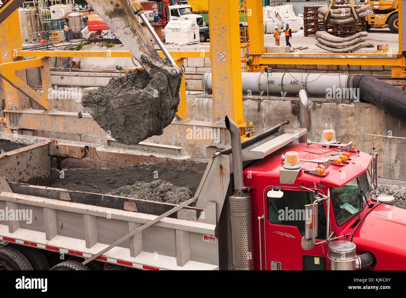 Cement being loaded into truck Stock Photo - Alamy