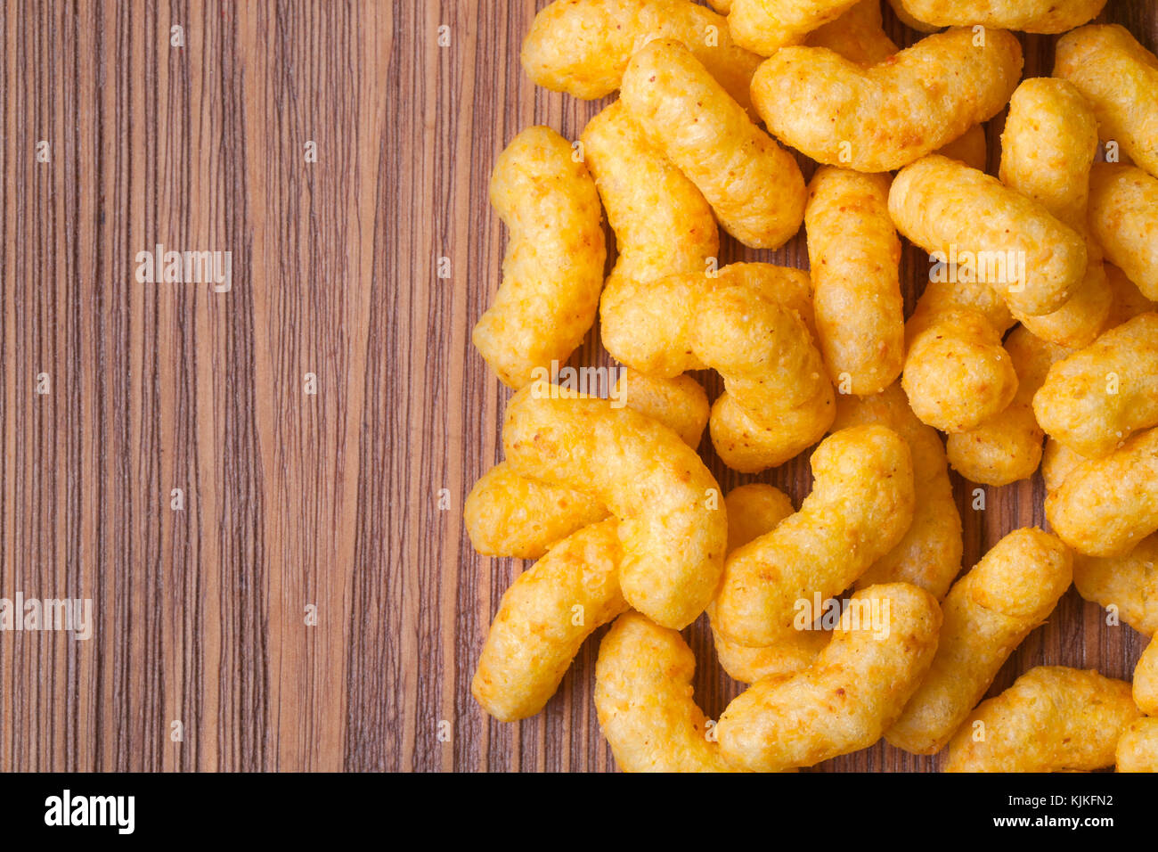 Children snacks with cheese and peanuts on wooden background Stock ...