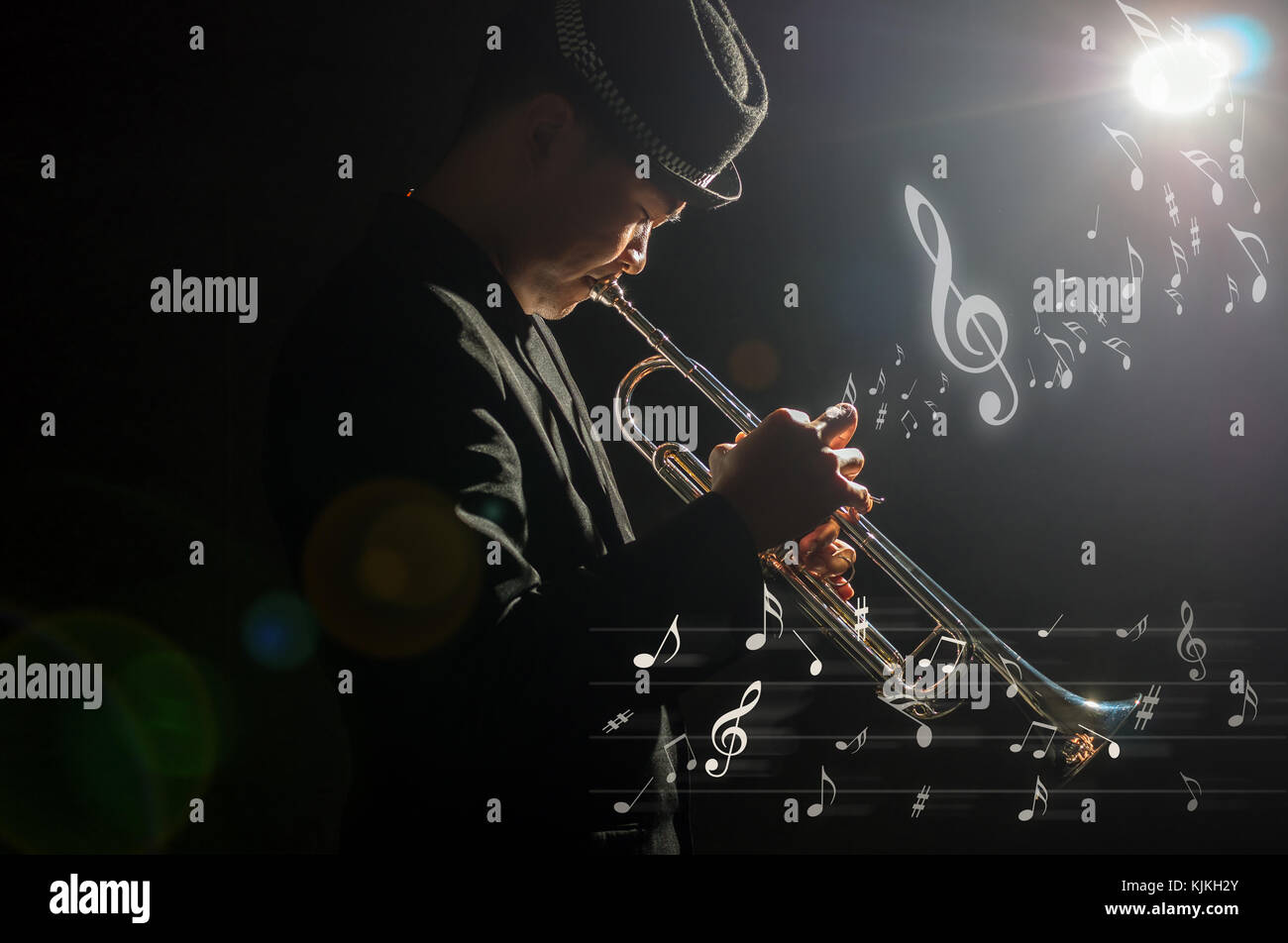 Musician playing the Trumpet with spot light and len flare with music ...