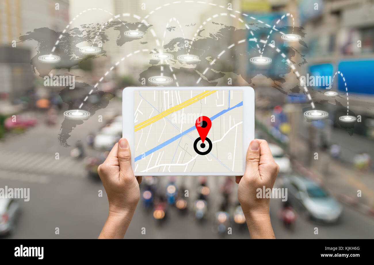 female hands holding a tablet showing part of navigator map on ...