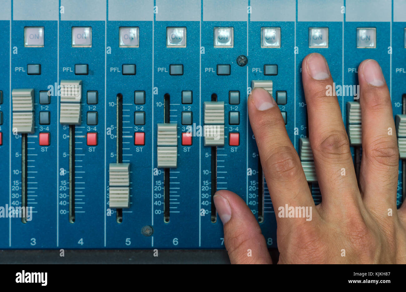 Top view of Hand adjusting audio mixer, music instrument concept Stock ...