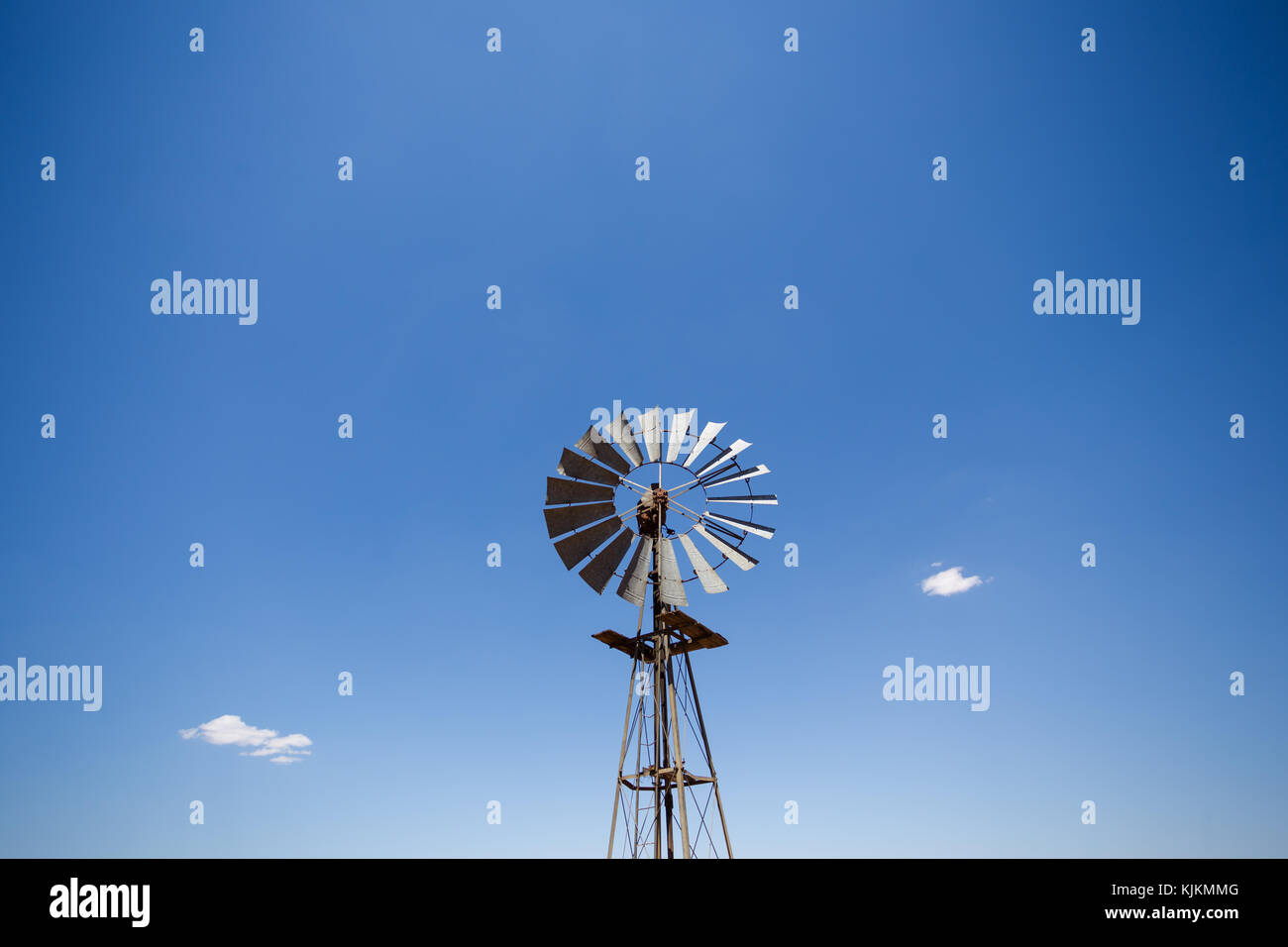 Close up wide angle image of a windmill / windpomp with static blades ...