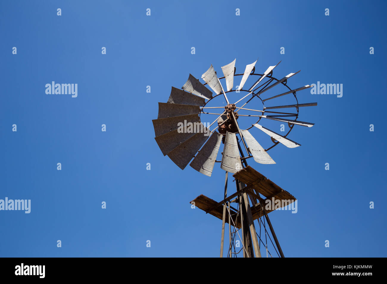 Close up wide angle image of a windmill / windpomp with static blades ...