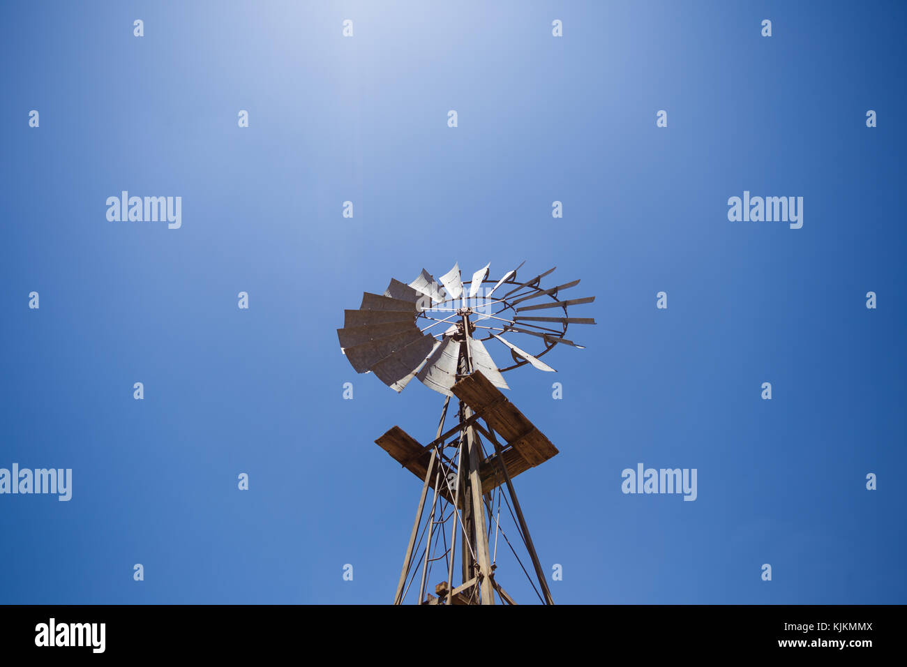 Close up wide angle image of a windmill / windpomp with static blades ...