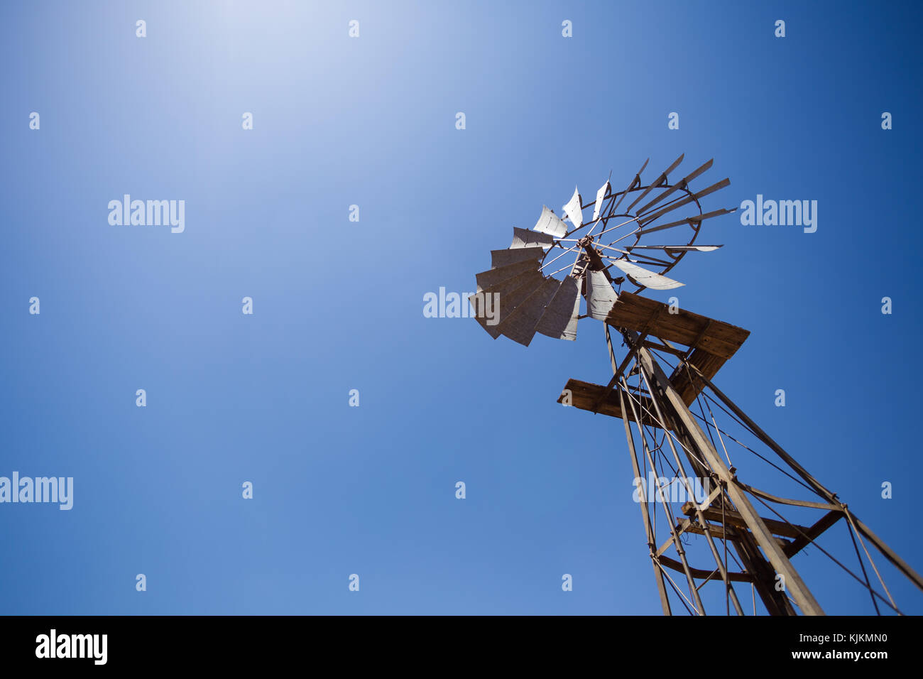 Close up wide angle image of a windmill / windpomp with static blades ...
