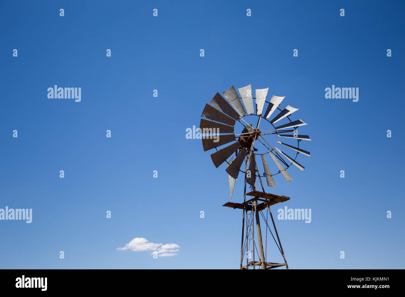 Close up wide angle image of a windmill / windpomp with static blades ...