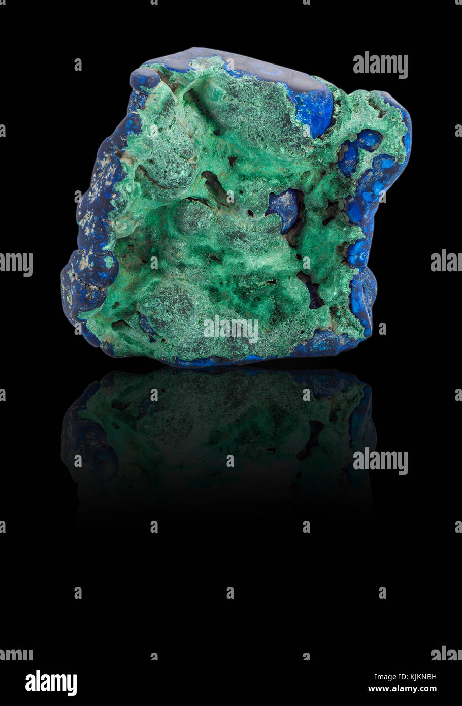 Blue and green Azurite gemstone with ground reflection on the black ...
