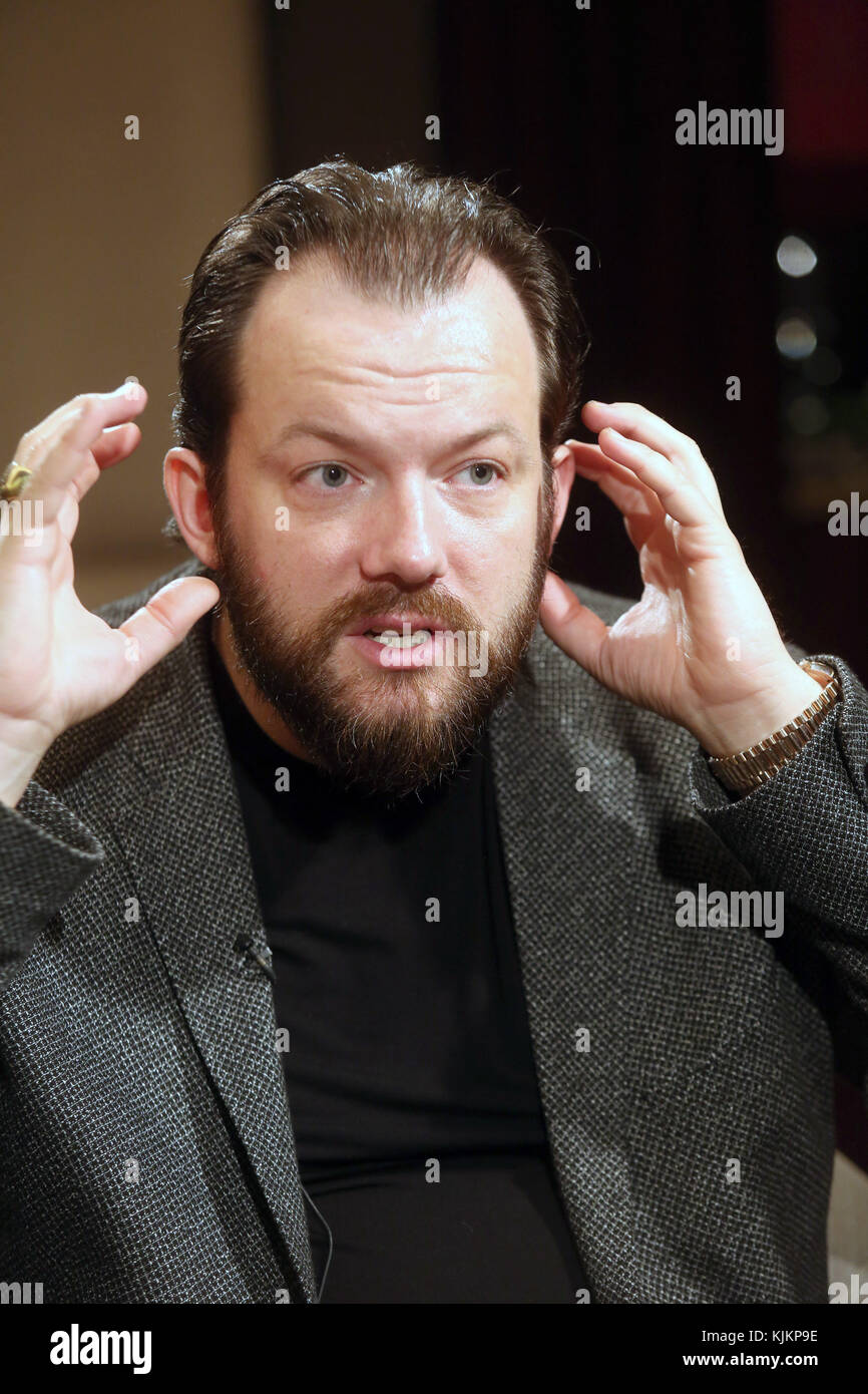 Latvian conductor Andris Nelsons talks with Chinese TV host Cao Kefan ...