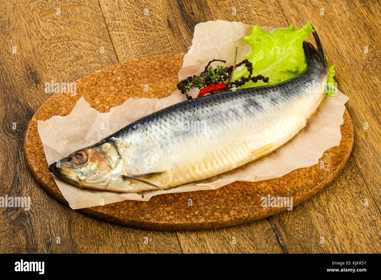 Salted Herring fish with pepper and spices Stock Photo - Alamy