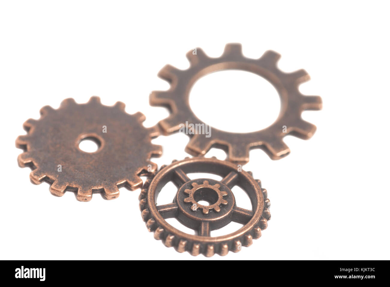 Three gears isolated on white background Stock Photo - Alamy