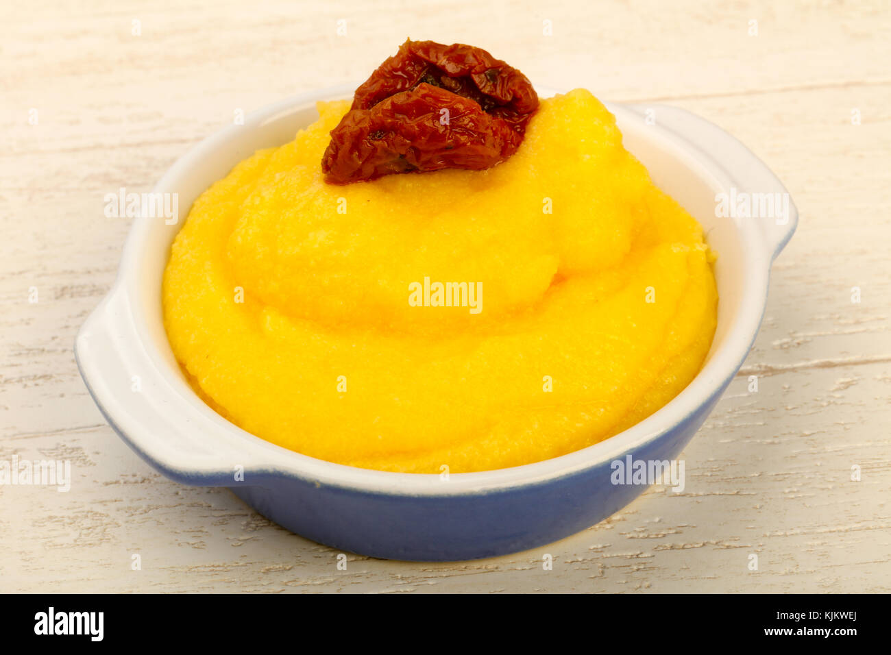 Polenta with dry tomato Stock Photo - Alamy