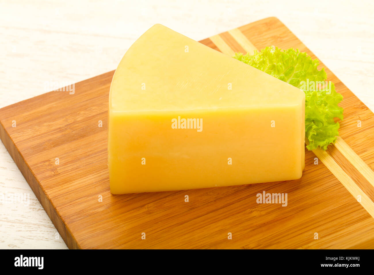 Parmesan cheese triangle Stock Photo - Alamy