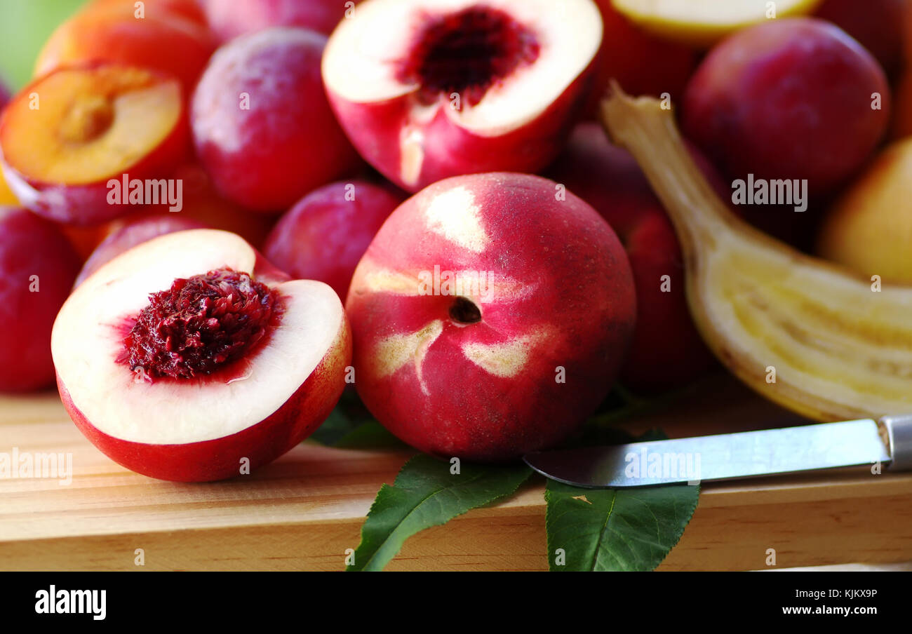ripe peaches, nectarines and plums on table Stock Photo - Alamy