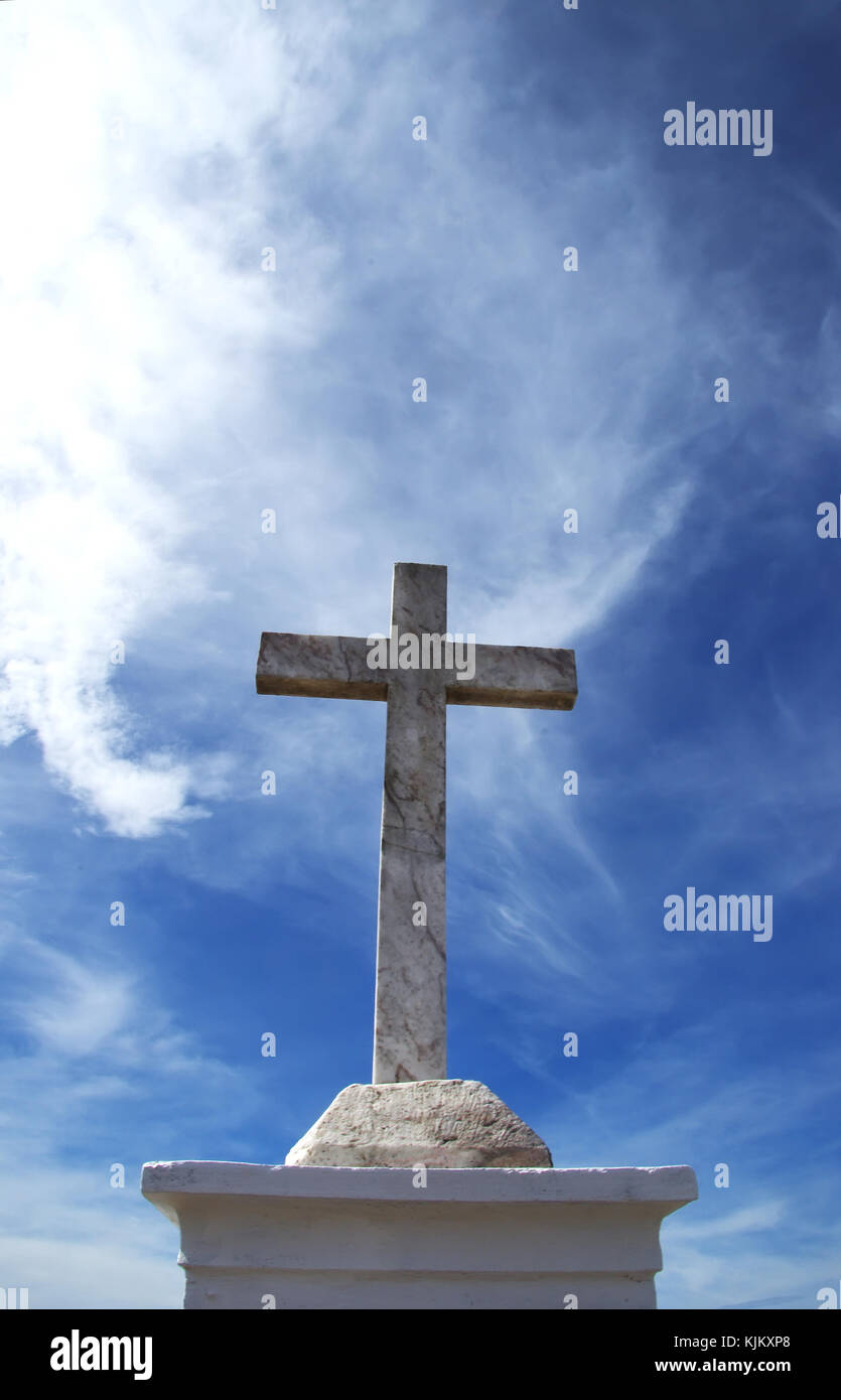 marble cross against blue sky with clouds Stock Photo - Alamy