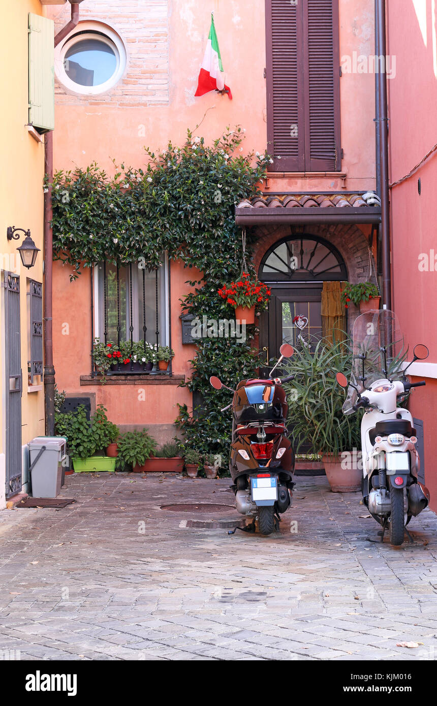 old house with Italian flag and scooters Rimini Italy Stock Photo - Alamy