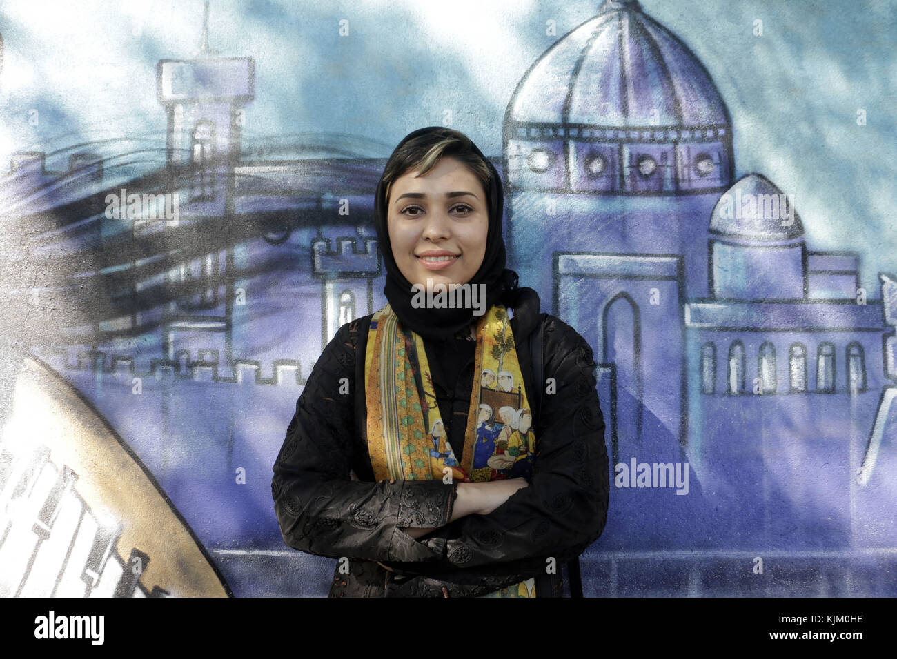 Afghanistan's first female street artist Shamsia Hassani with her mural ...